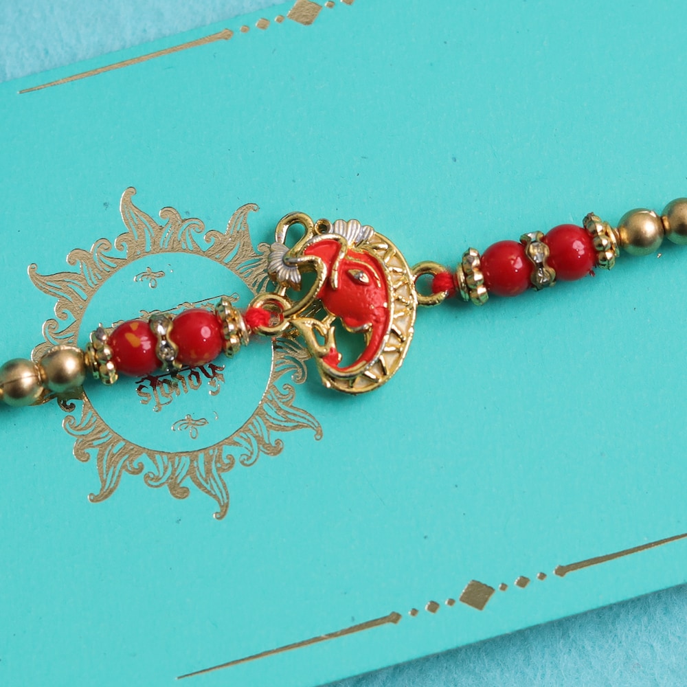 Designer Orange Ganesha Rakhi | Winni